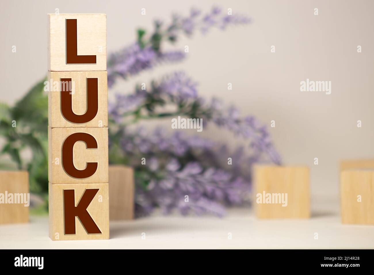 Letter block in word luck on wood background Stock Photo - Alamy