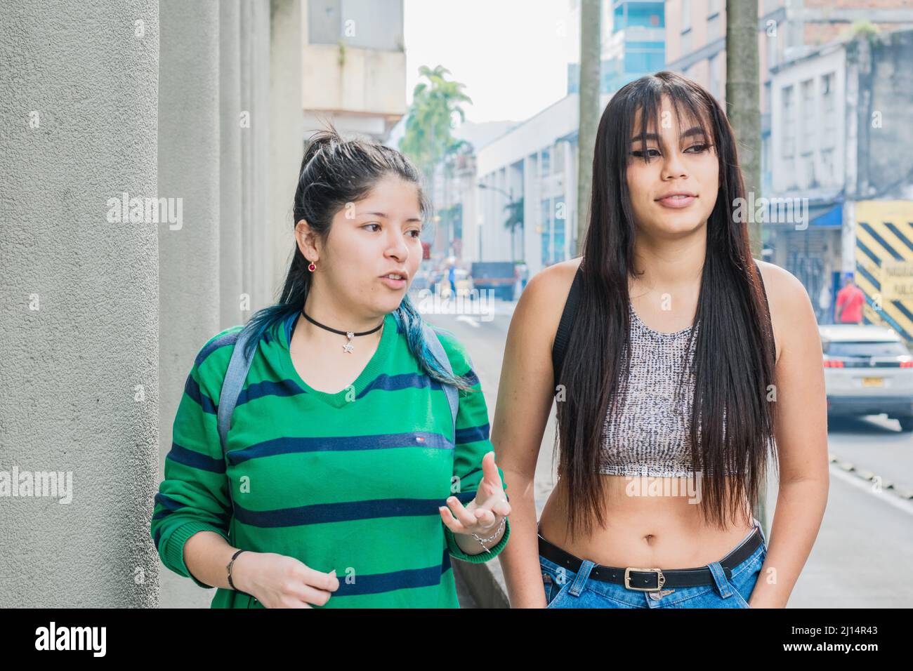 two beautiful latina women (friends), one Caucasian girl and the other ...