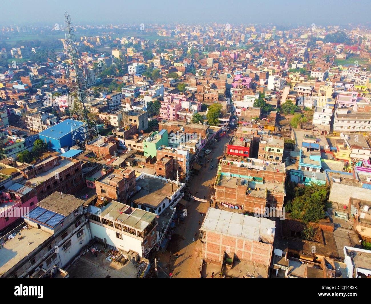 High-angle shot of a city with colorful low buildings scattered all ...