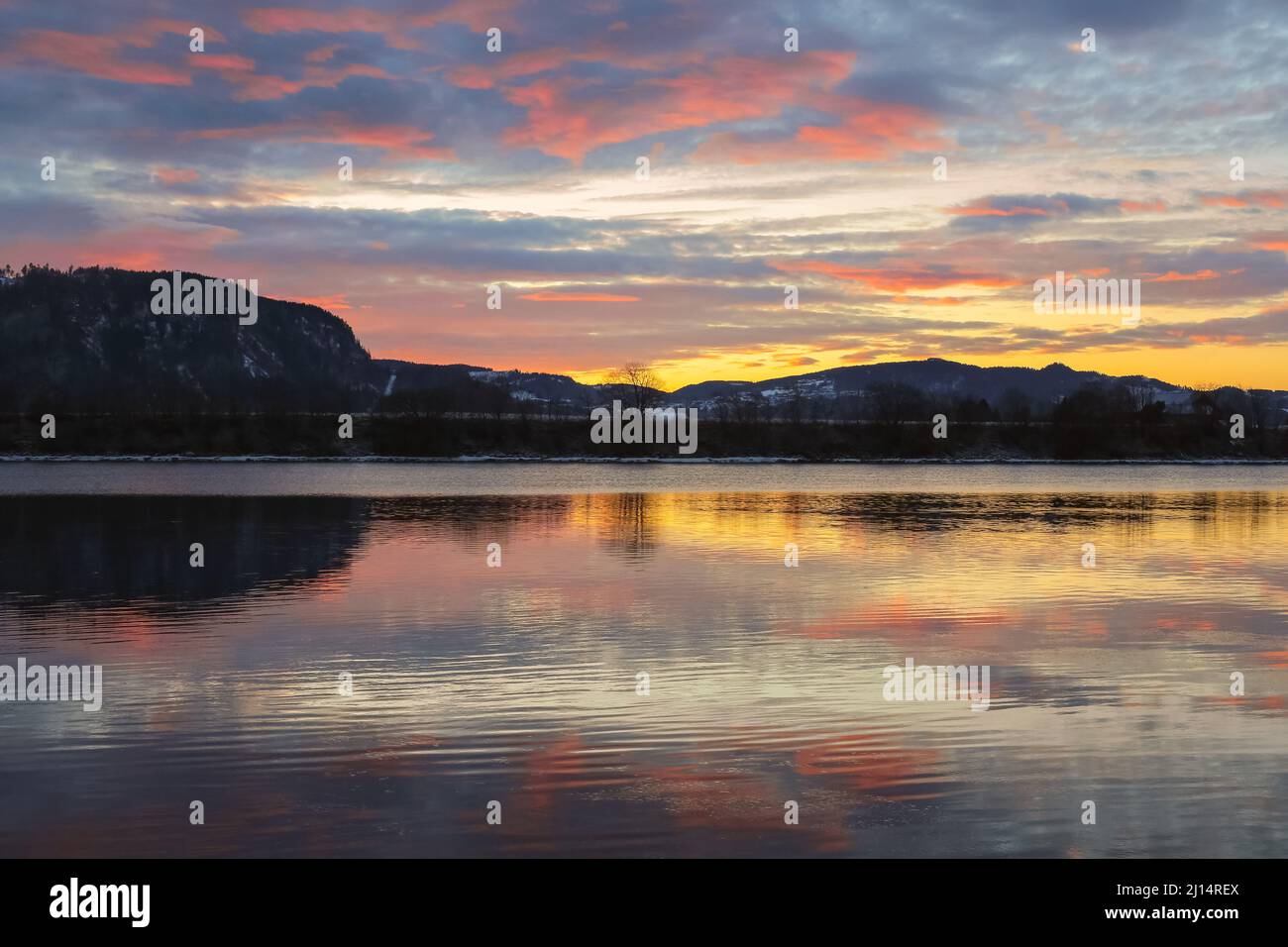 Sunset at the river Gaula, view of the Oesand agricultural area and ...