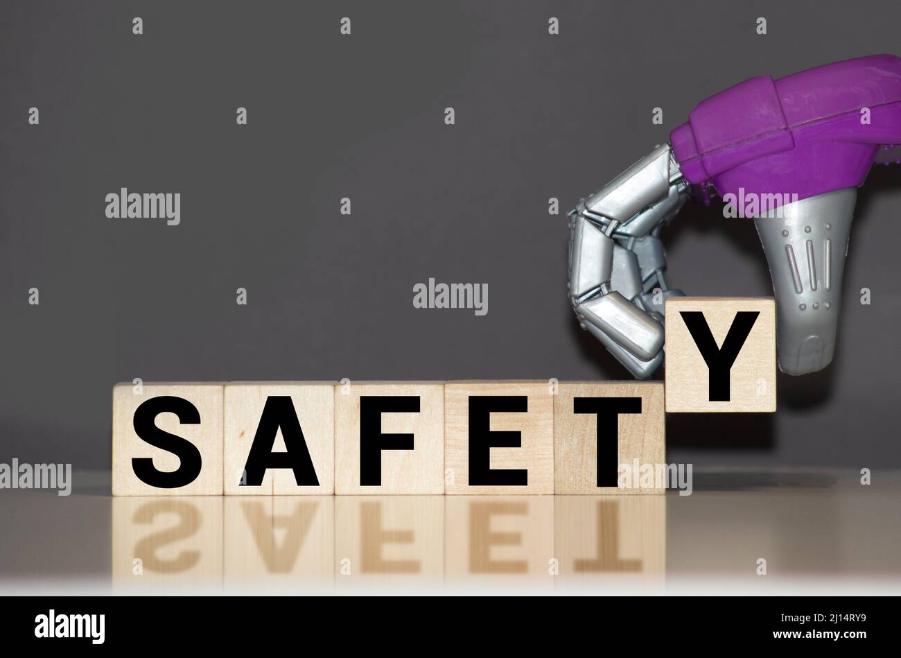 safety word written on wood block, concept Stock Photo - Alamy