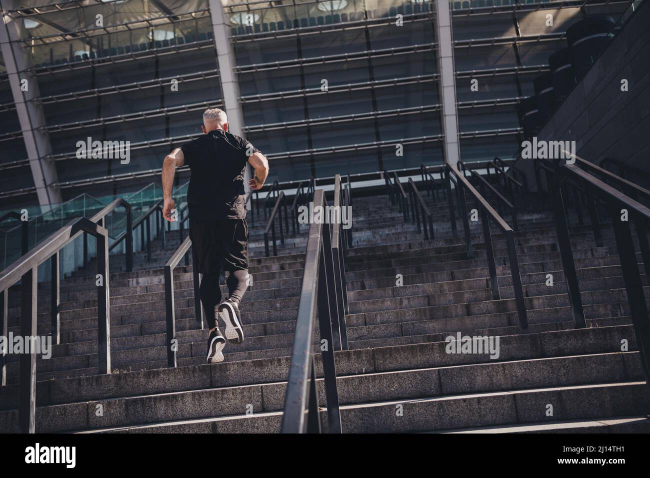 Mature man running up stairs hi-res stock photography and images - Alamy