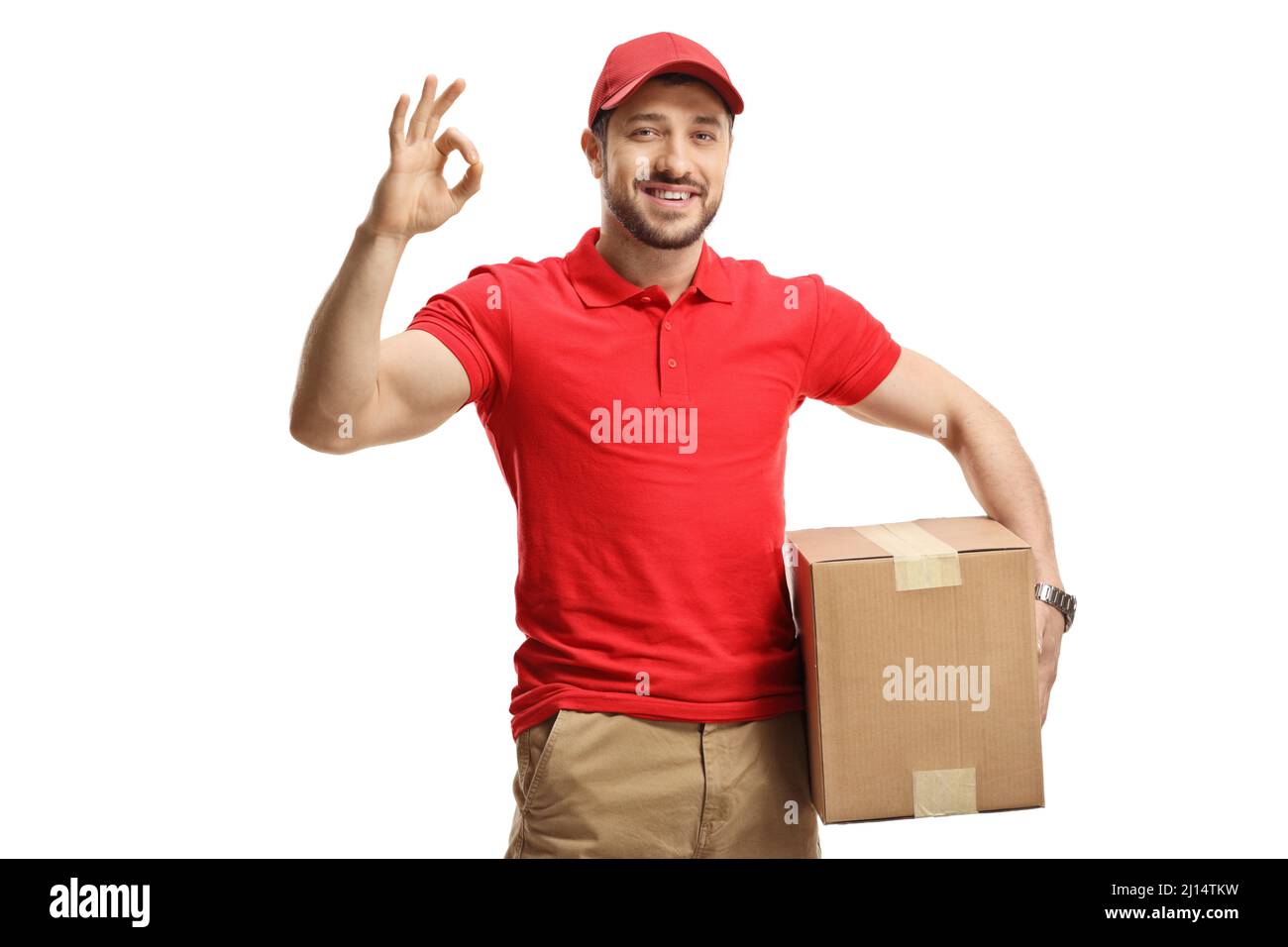 Smiling delivery man with a package gesturing a great sign isolated on ...