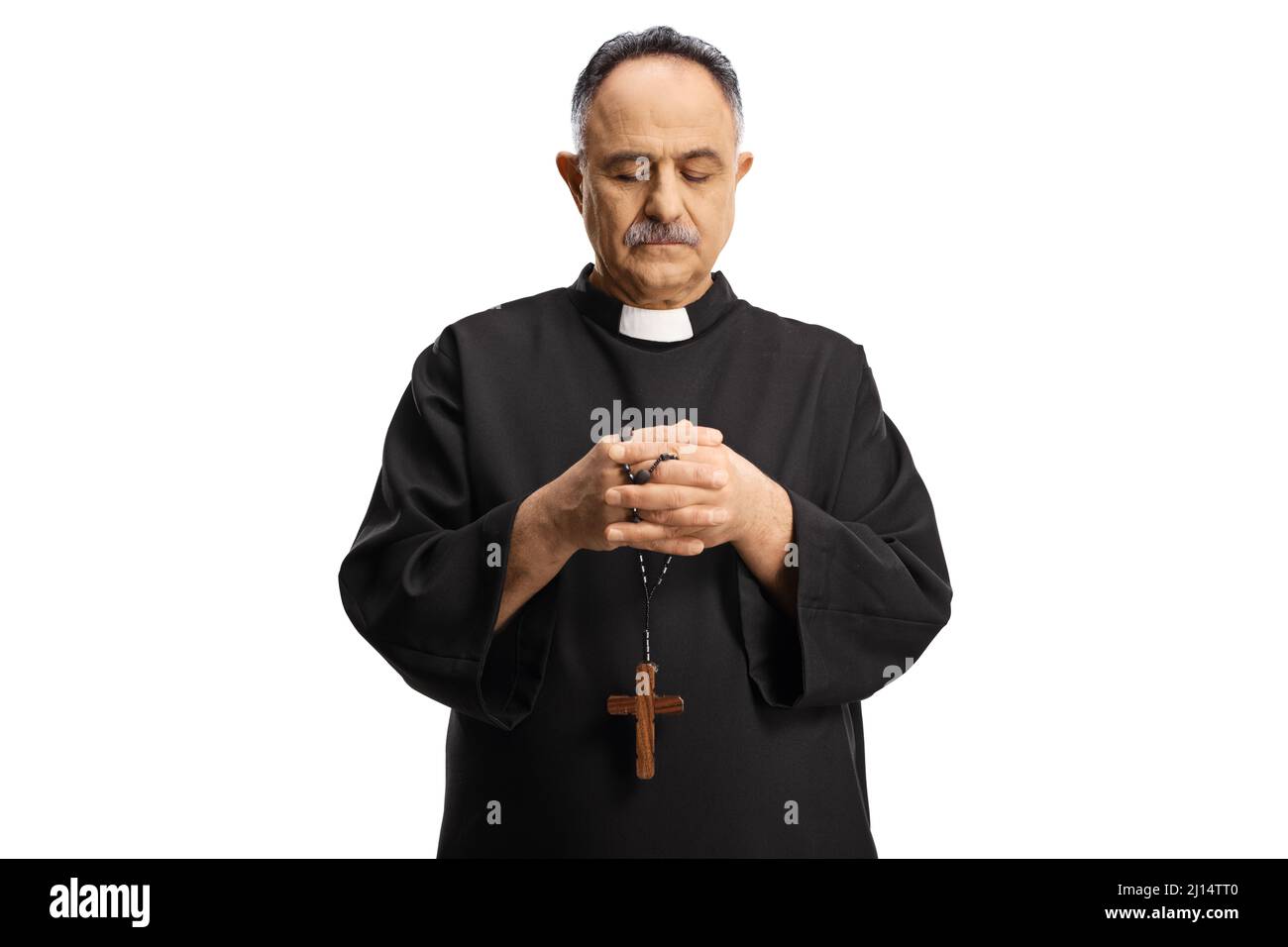 Mature priest holding prayer beads and looking down isolated on white ...