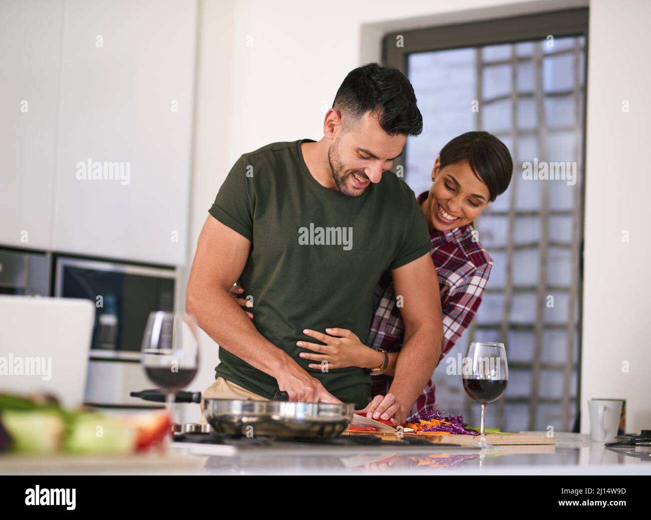 The best food is made together. Cropped shot of a young attractive ...