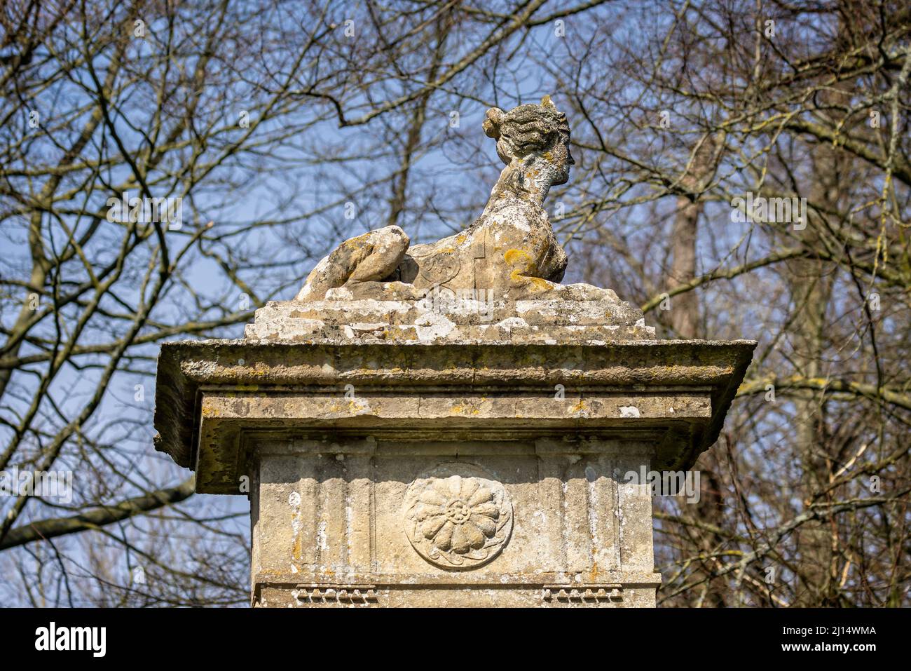 Statue of a Sphinx with female head on plinth at Lacock Abbey ...