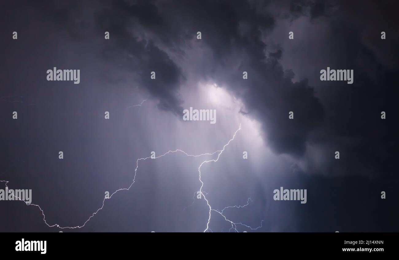 Dark ominous clouds. Thunderstorm with lightning Stock Photo - Alamy