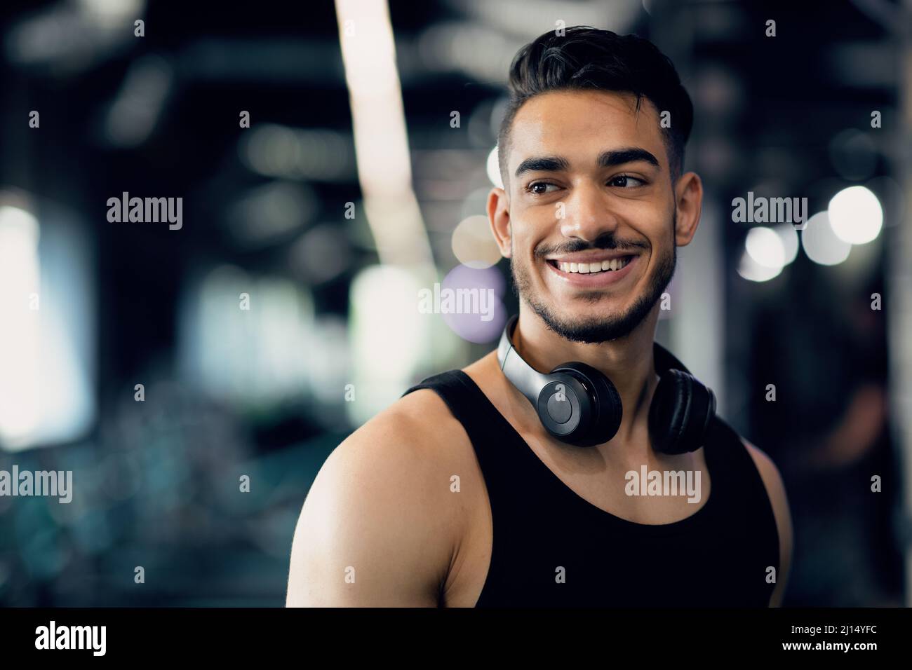 Man wearing headphones around neck hi-res stock photography and images ...