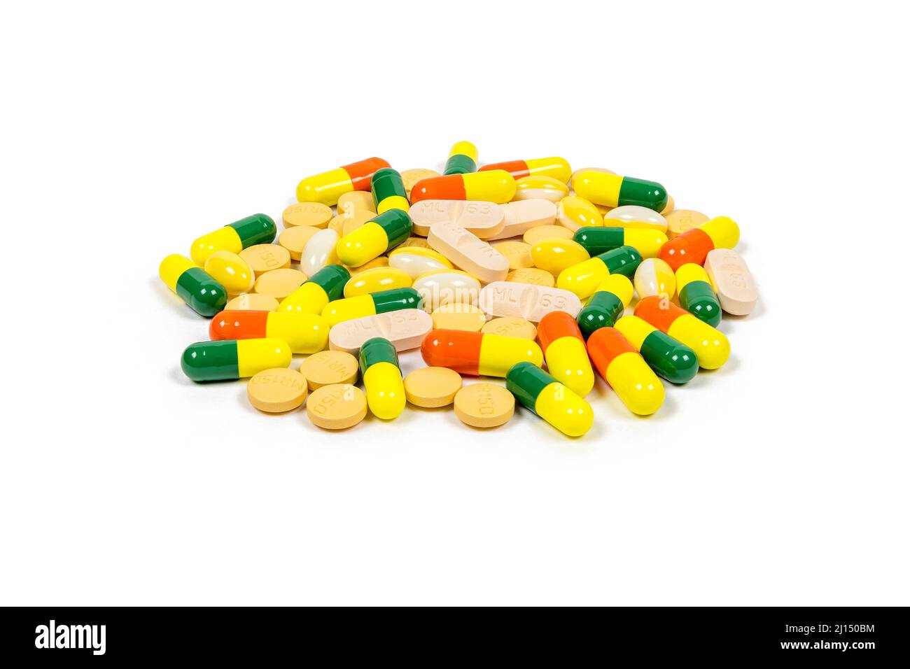 Pile of multi coloured pills, tablets and capsules on pure white ...