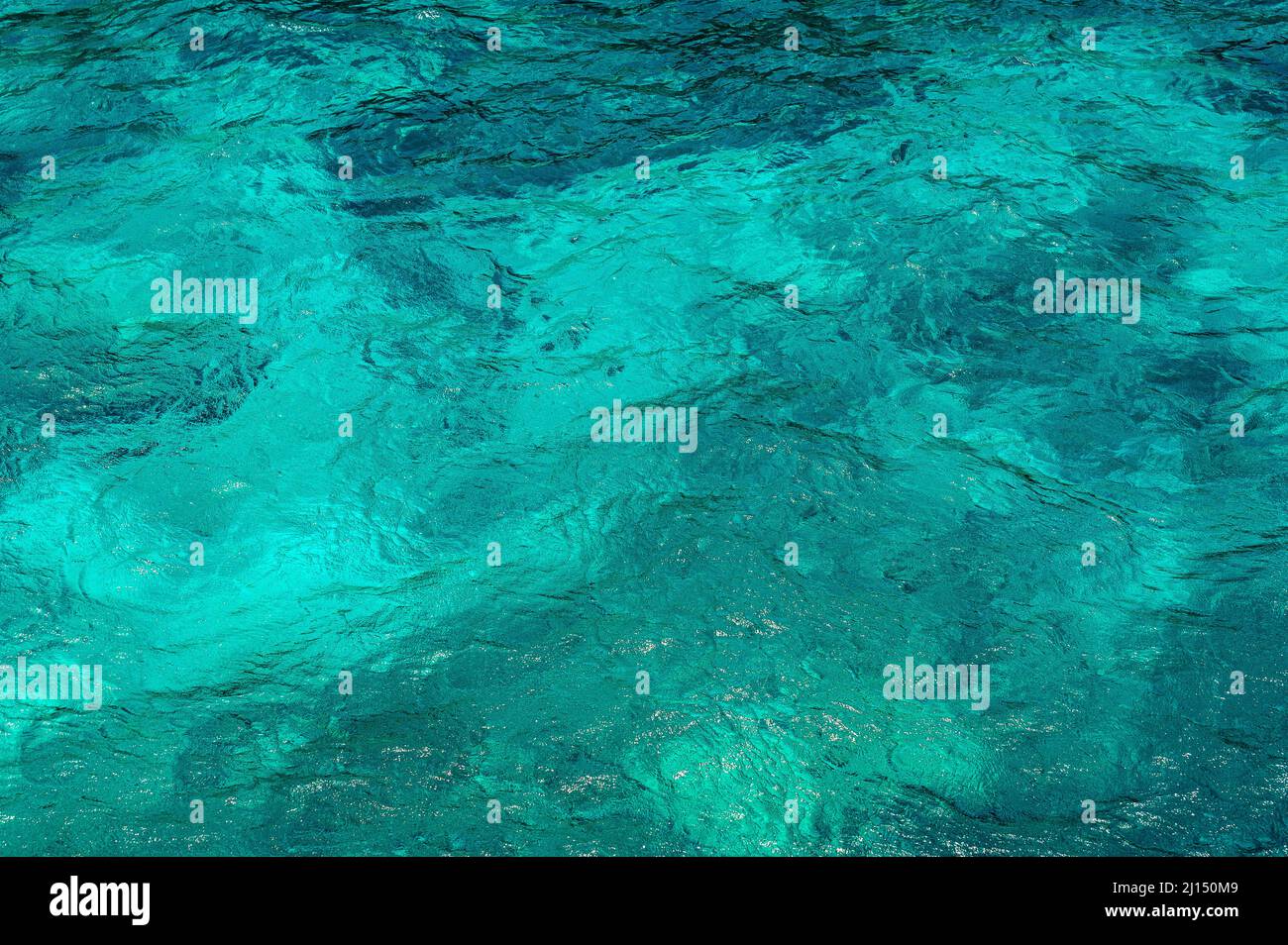 Photo shows texture of ocean. Surface of sea is turquoise. Ocean water ...