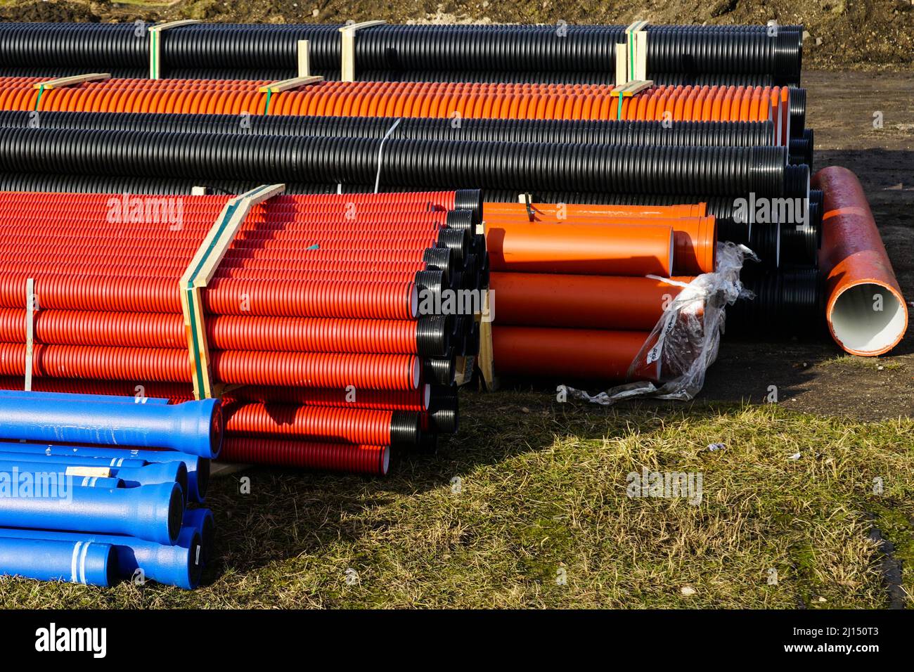 underground communication plastic pipes of various colors and diameters ...