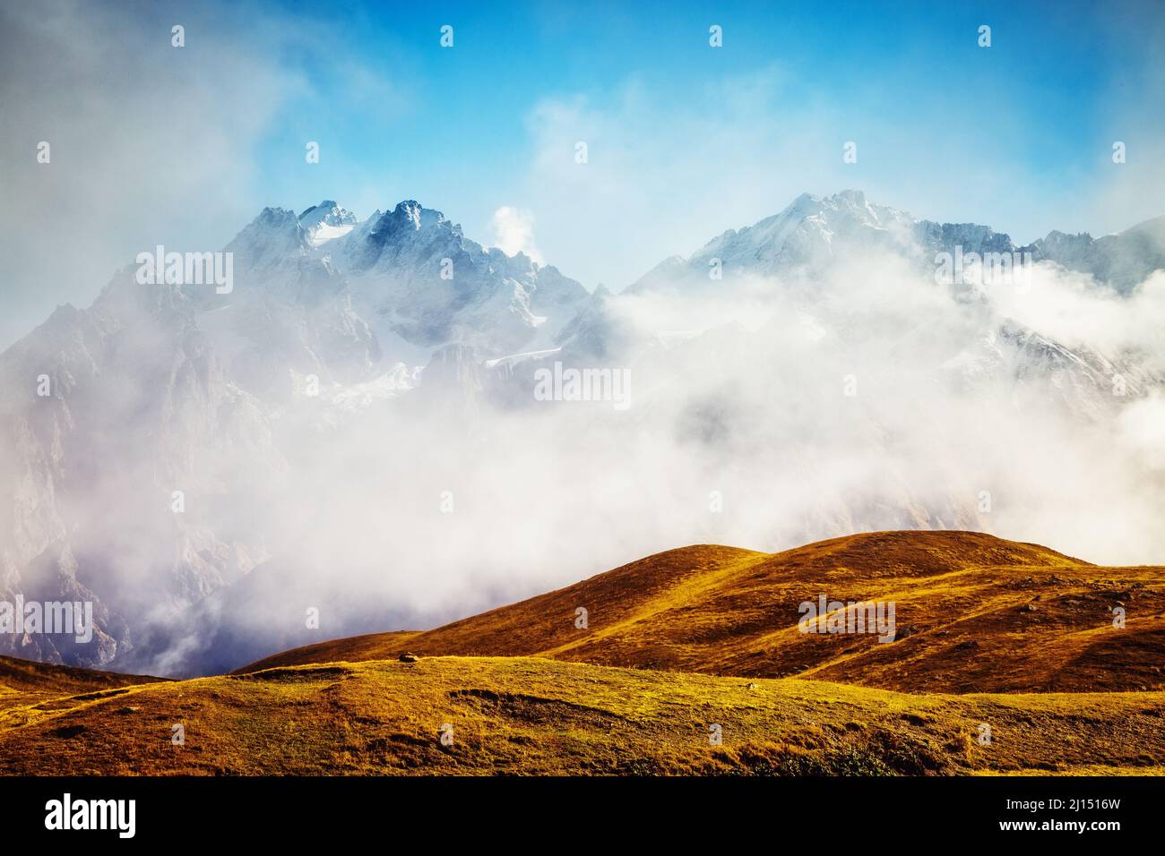 Fantastic lake Koruldi at the foot of Mt. Ushba. Dramatic foggy scene ...
