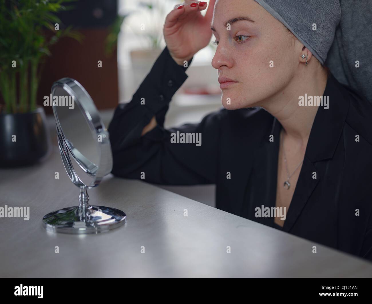 woman feeling shock while looking problem with skin condition after ...