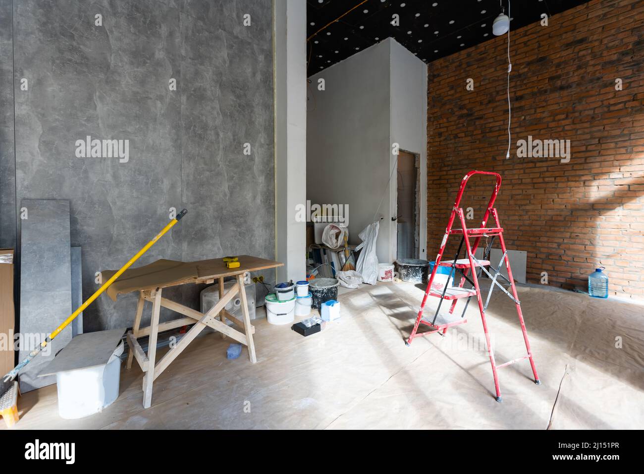 House indoor improvements in a messy room construction with plaster ...