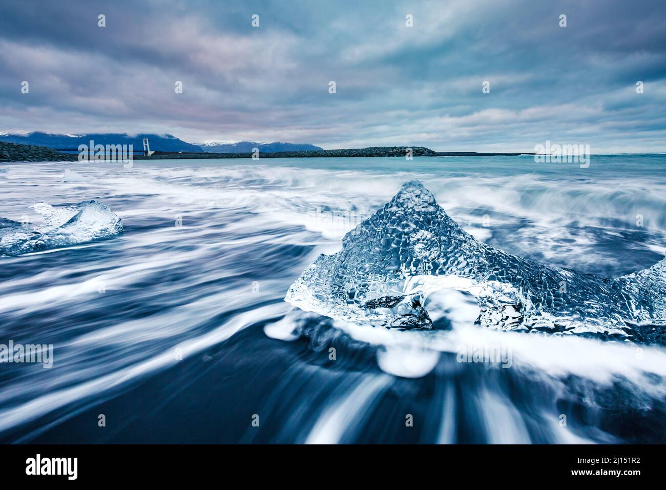 Great view of the ice fragments on black sand. Popular tourist ...