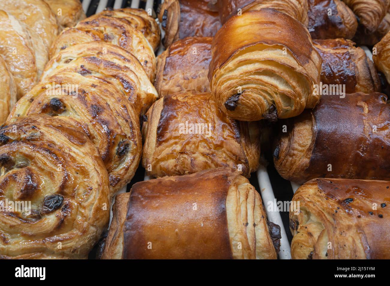 Artisan baker and pastry chef. Detail of mixed pastries in a bakery ...