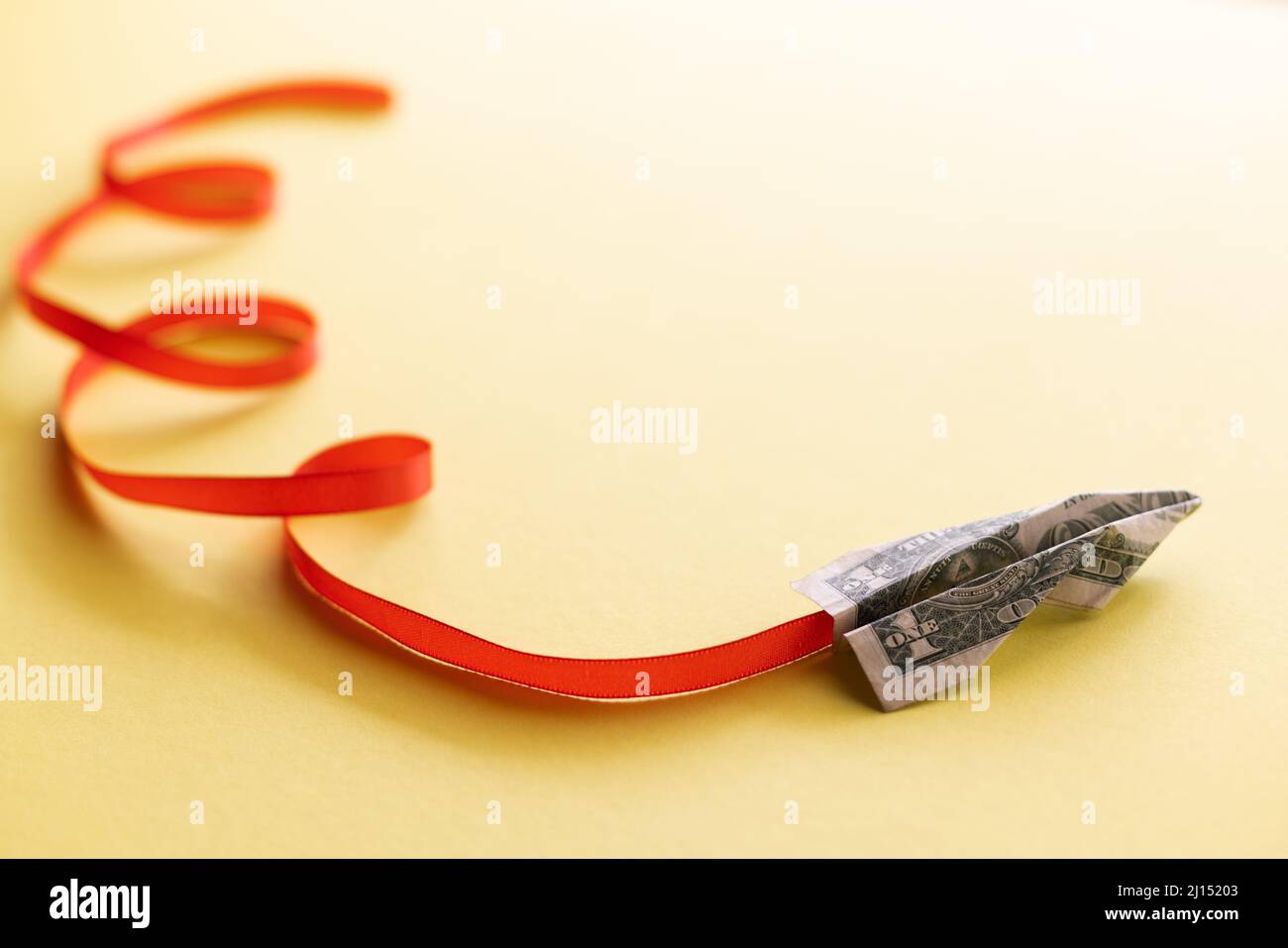 Paper plane made of one dollar bill Stock Photo - Alamy