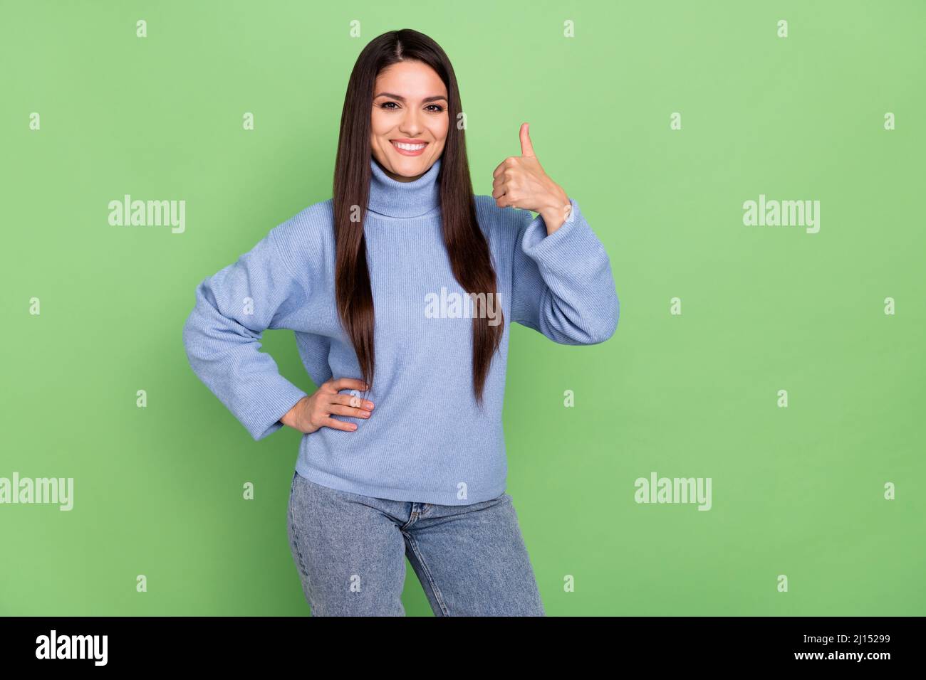 Portrait of attractive cheerful woman showing thumbup agree nice advert ...