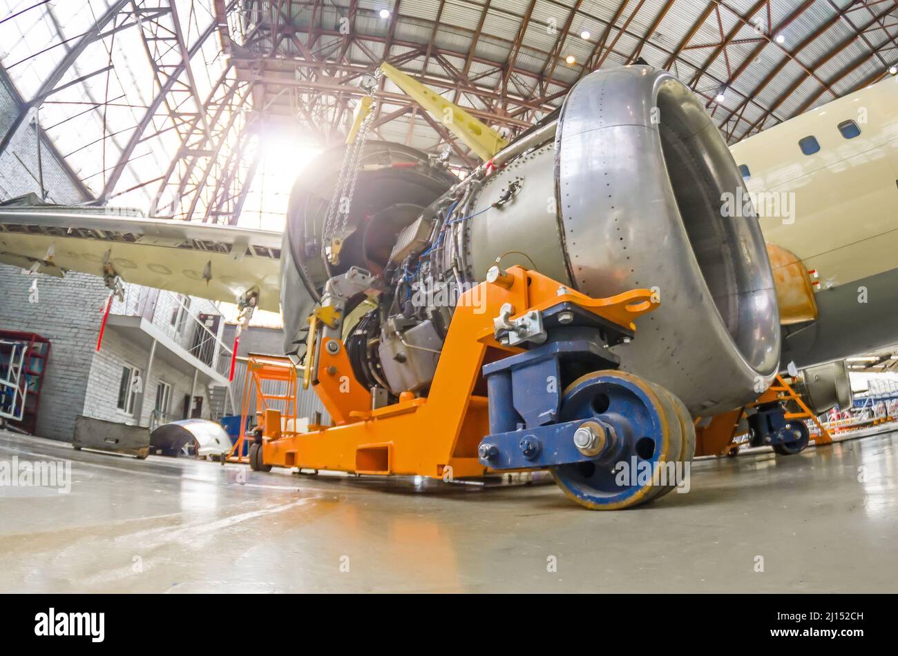 The engine of the aircraft is repaired, removed from the wing and ...