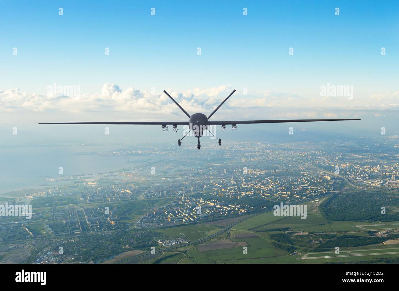 Unmanned military drone uav flying in the air over the city in the ...