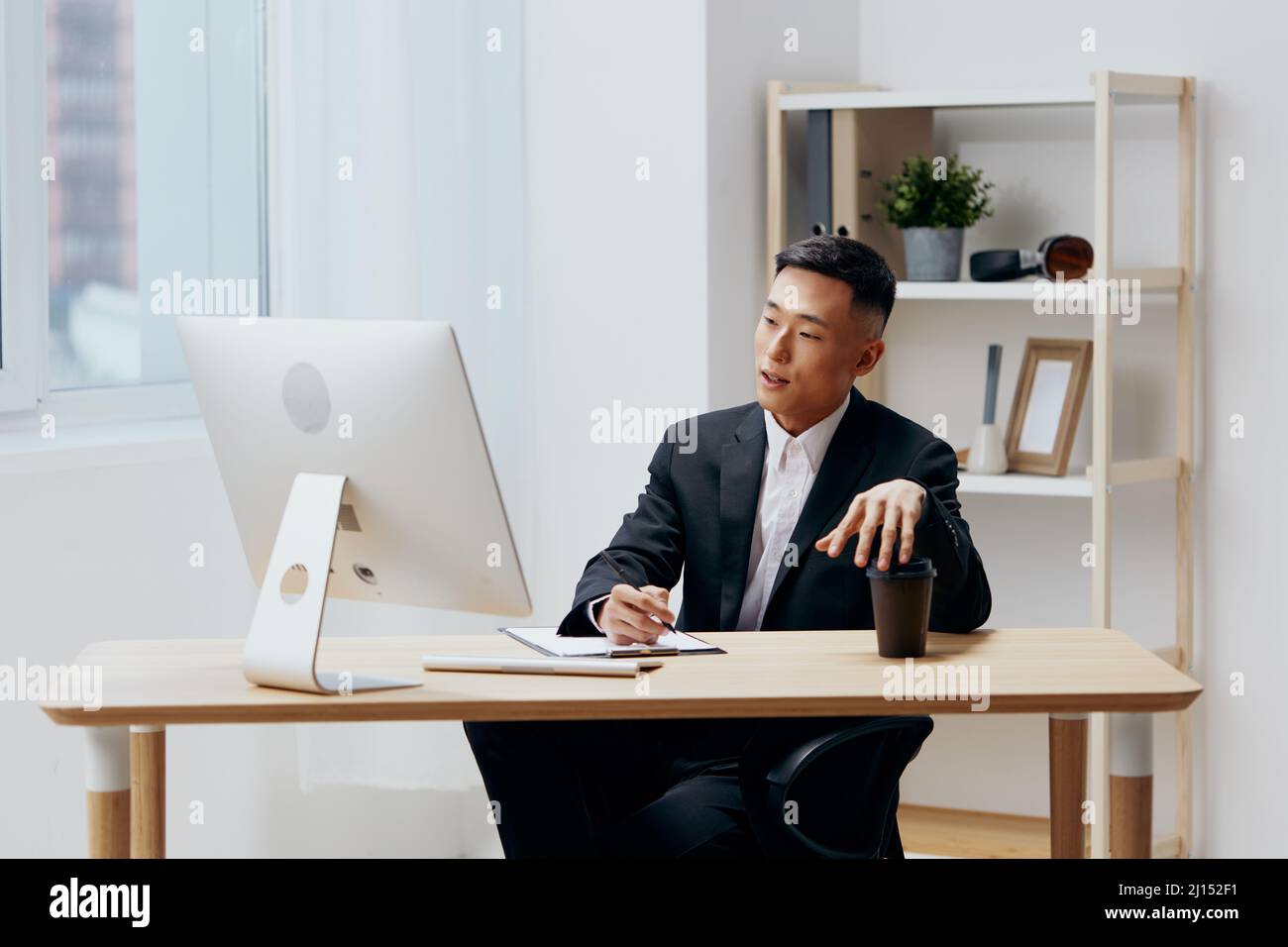manager sitting at a desk in front of a computer emotions Lifestyle ...