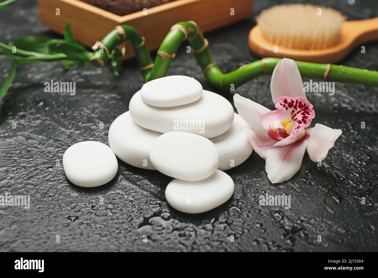 Spa stones on black background Stock Photo - Alamy