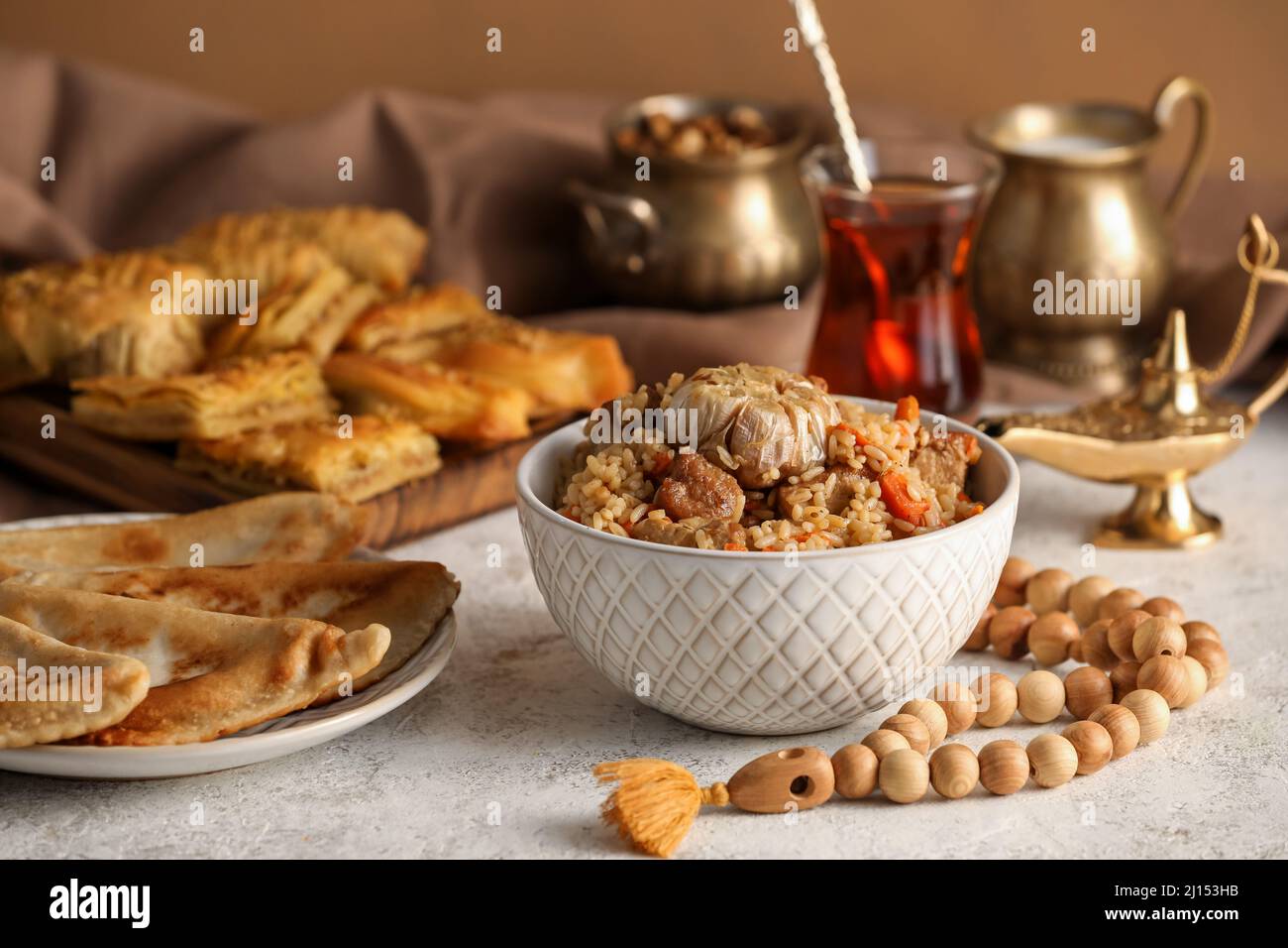 Traditional Eastern dishes with tasbih on table Stock Photo - Alamy