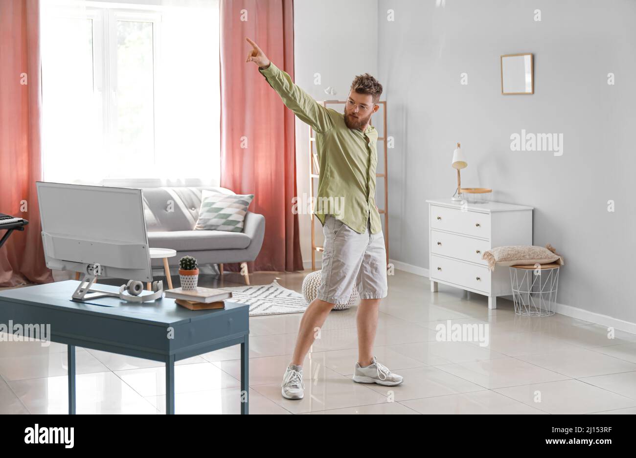 Cool young man learning to dance at home Stock Photo - Alamy