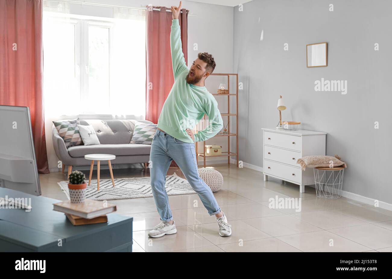 Cool young man learning to dance at home Stock Photo - Alamy