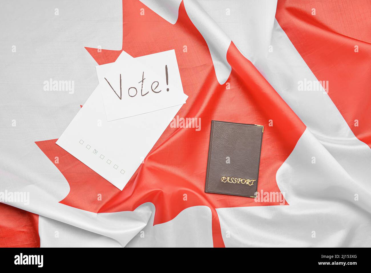 Paper sheets with word VOTE and passport on Canadian flag Stock Photo ...