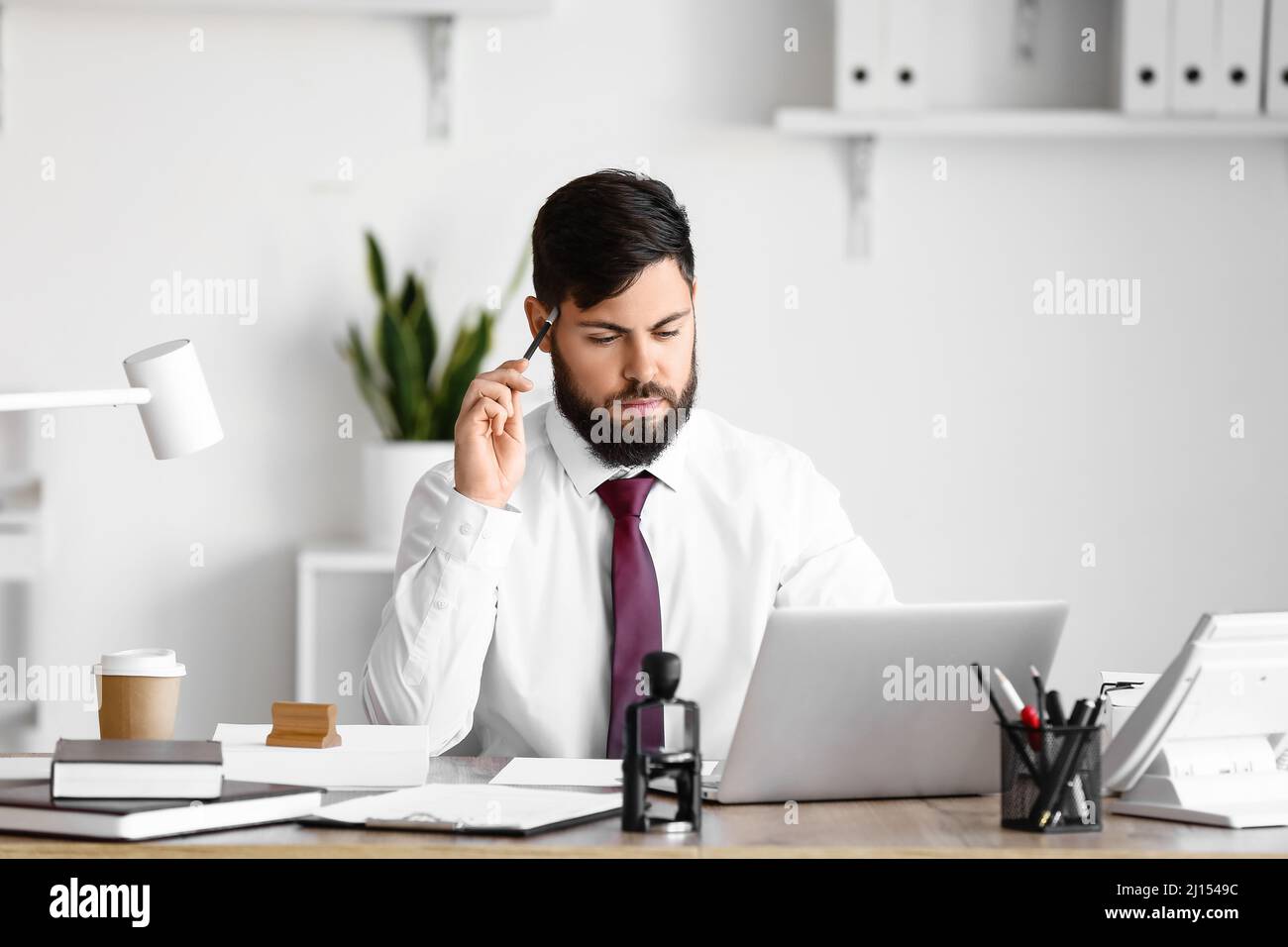 Male notary public working in office Stock Photo - Alamy
