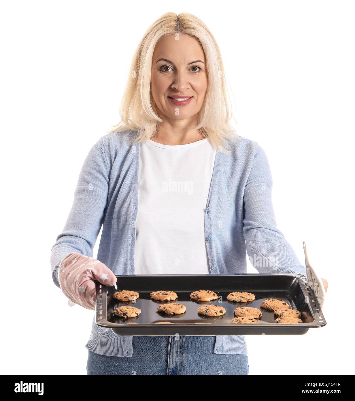 Mature woman holding baking dish with cookies on white background Stock ...