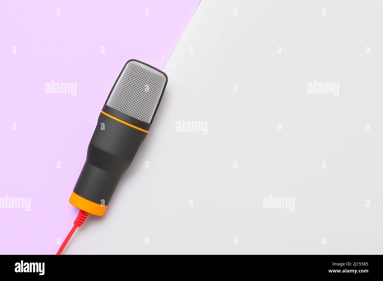 New modern microphone on color background Stock Photo - Alamy