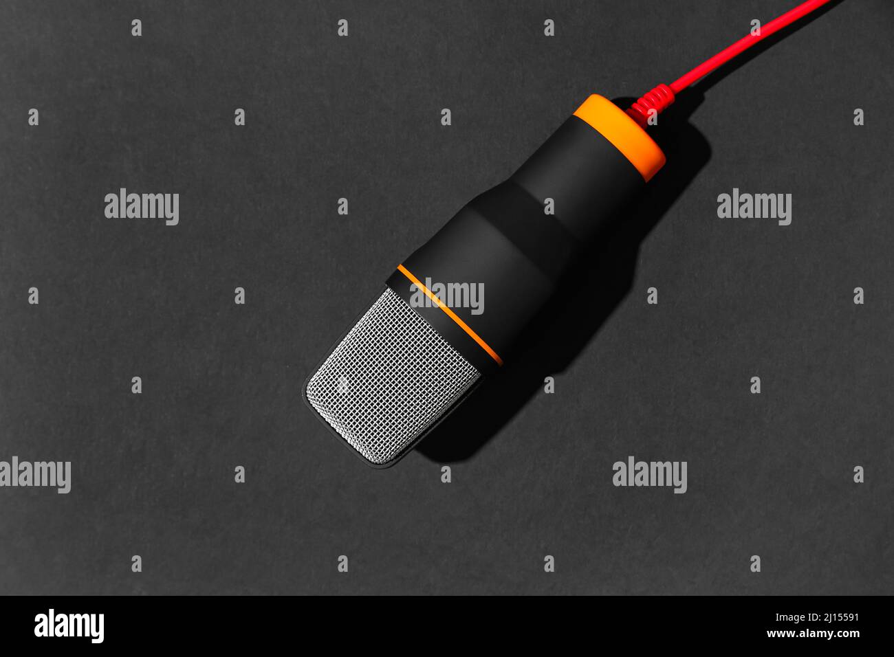 New modern microphone on dark background Stock Photo - Alamy