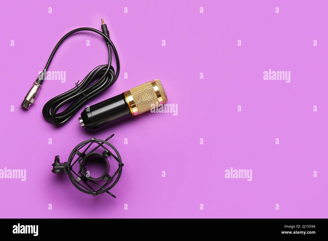 Modern microphone with stand and wire on purple background Stock Photo ...