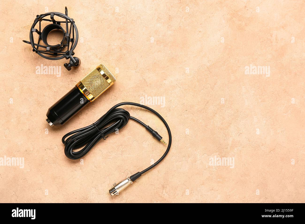 Modern microphone with stand and wire on color background Stock Photo ...