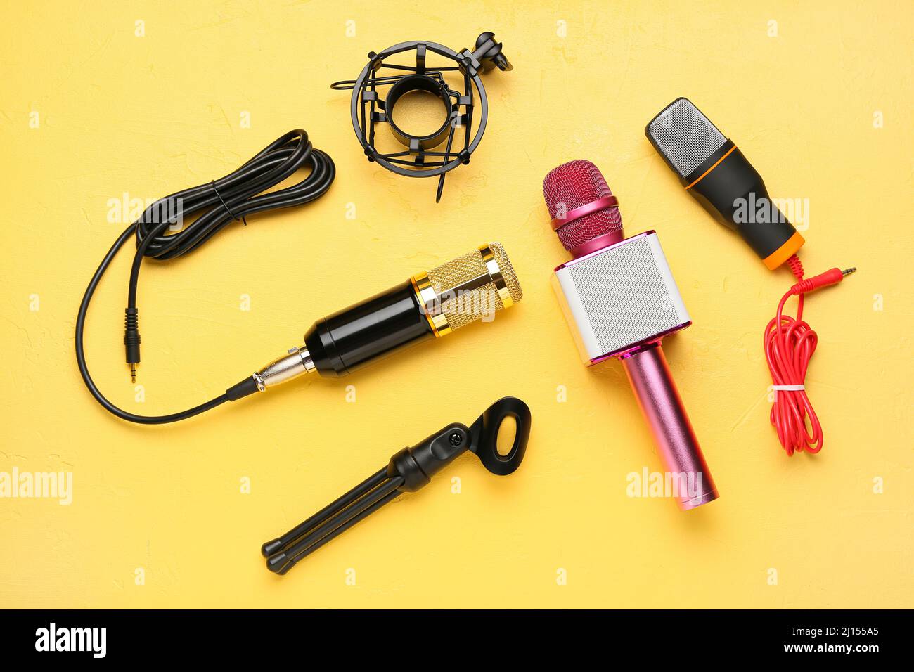 New modern microphones on color background Stock Photo - Alamy