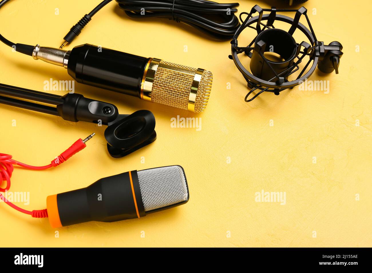 New modern microphones on color background Stock Photo - Alamy