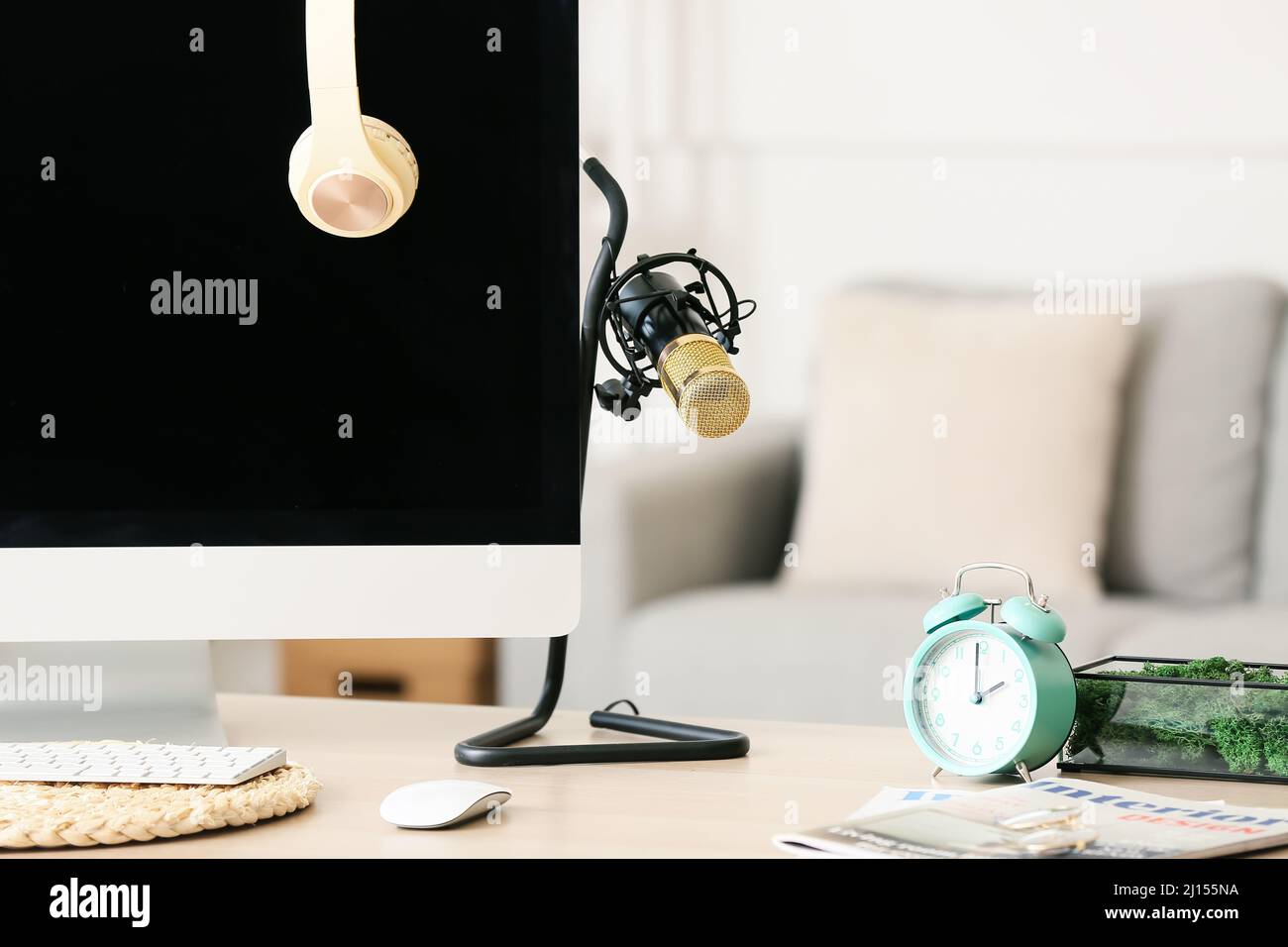 Modern workplace with microphone and computer in room Stock Photo - Alamy