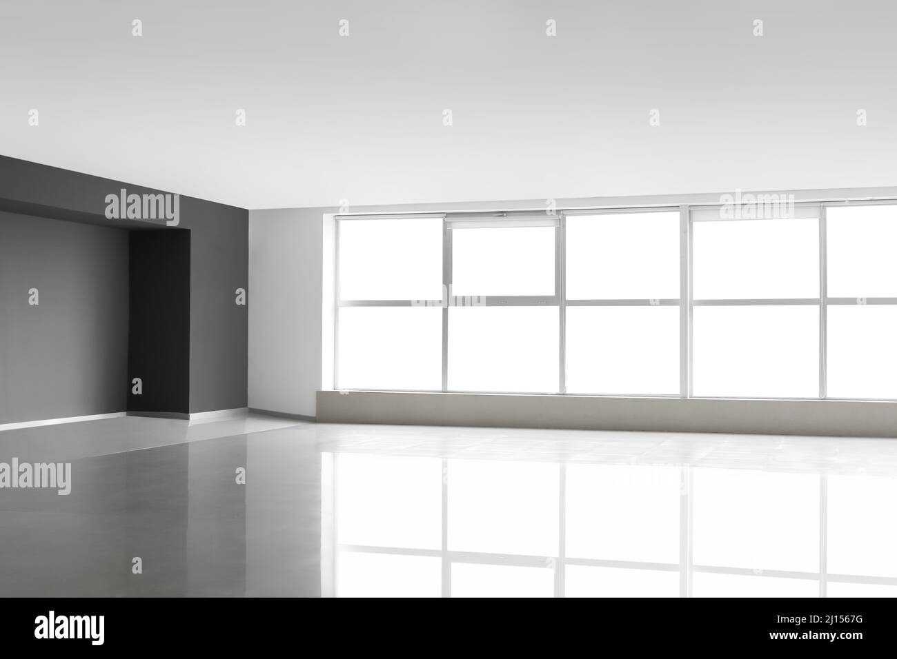View of big modern empty room with windows Stock Photo - Alamy