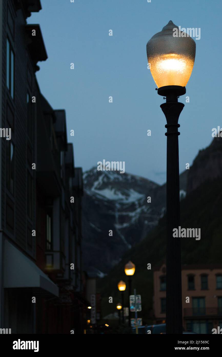 Mountainous ski town lamp post at twilight Stock Photo - Alamy