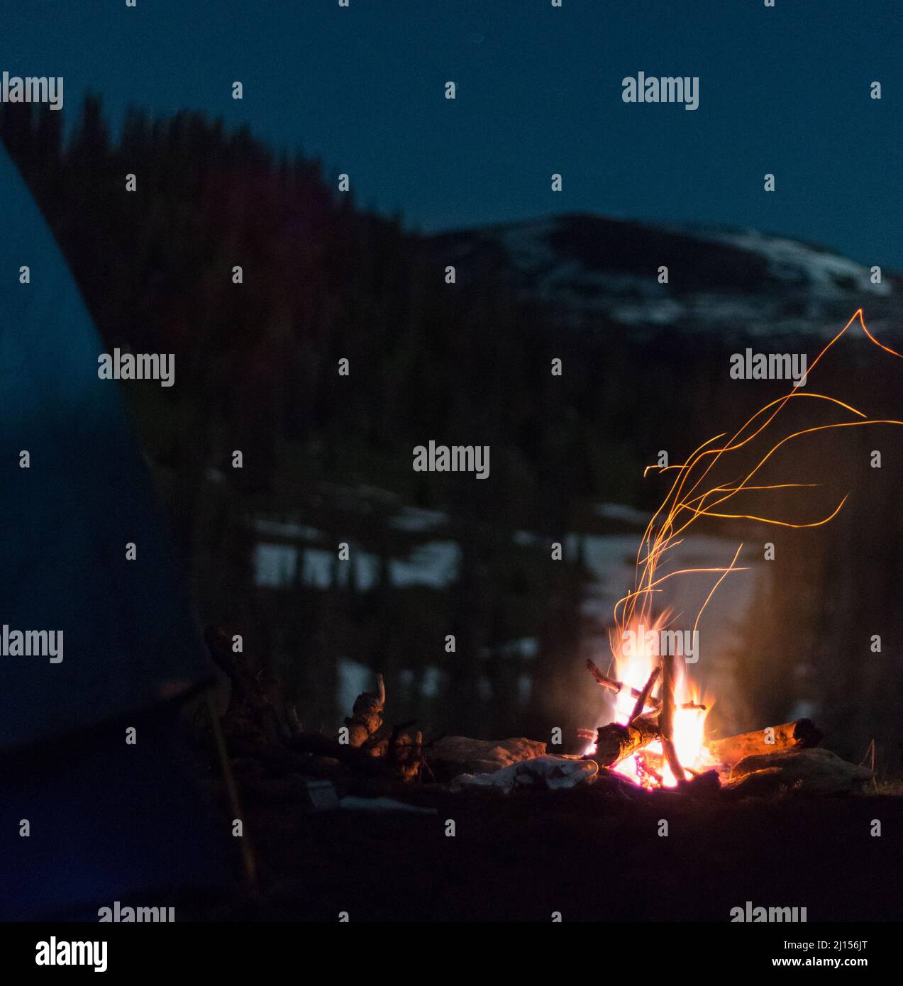Fire burning at campsite in the deep of night Stock Photo - Alamy