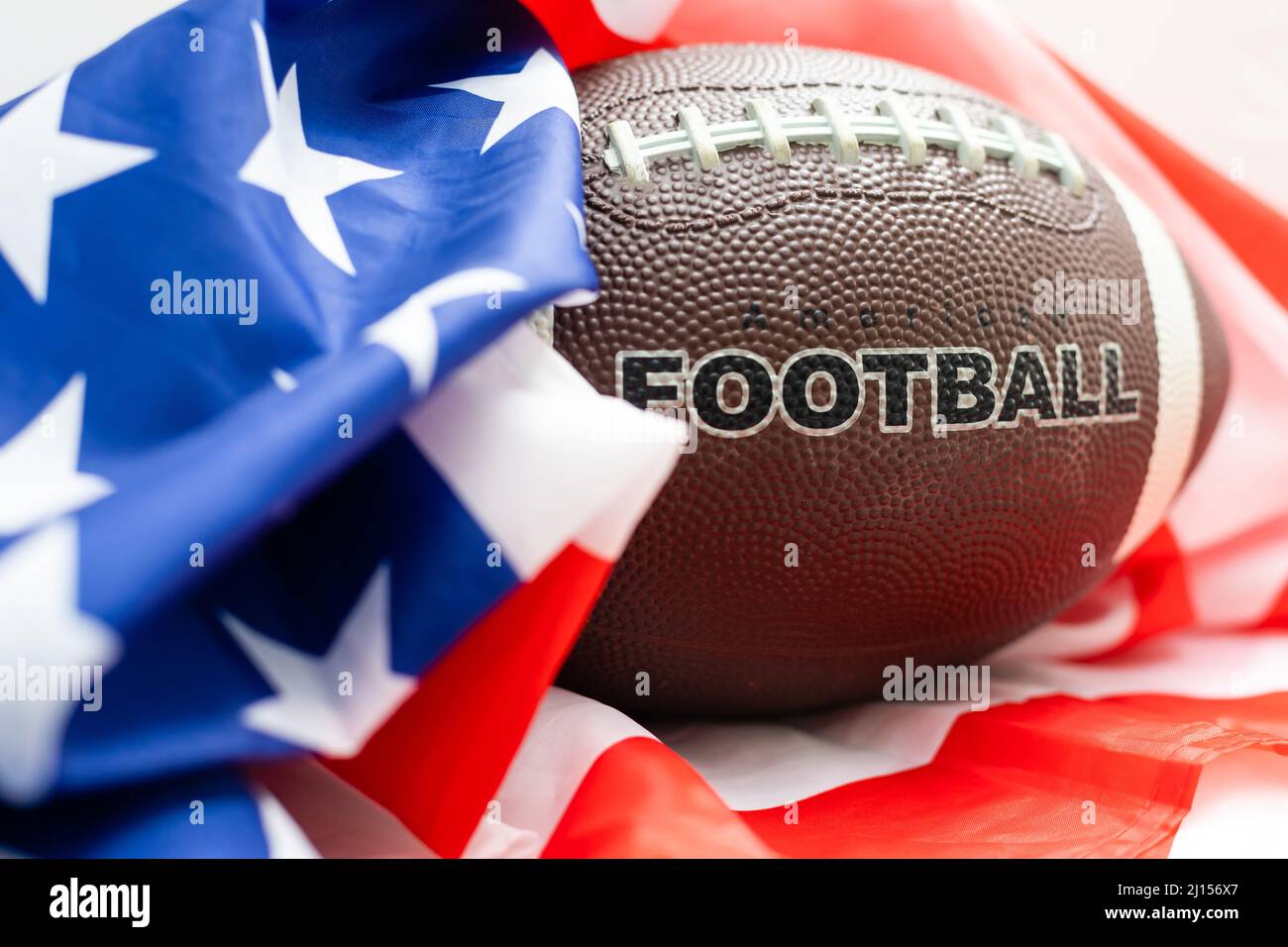 American football rugby ball against american flag Stock Photo - Alamy