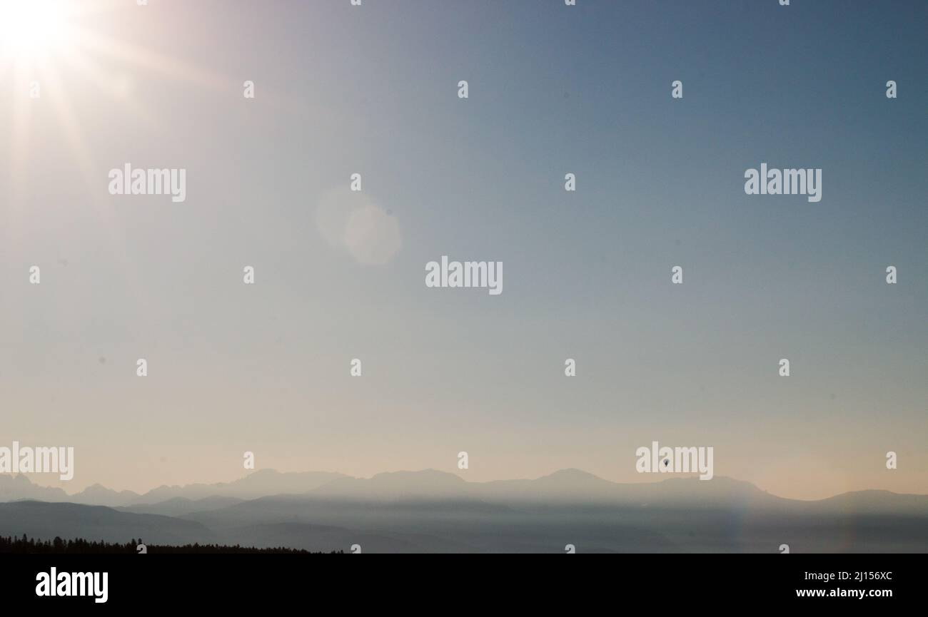 Horizontal sky and moutain landscape with sun rays and copy space Stock ...