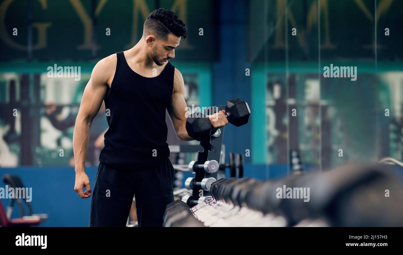 Bodybuilding Concept. Muscular Young Arab Man Training With Dumbbells ...