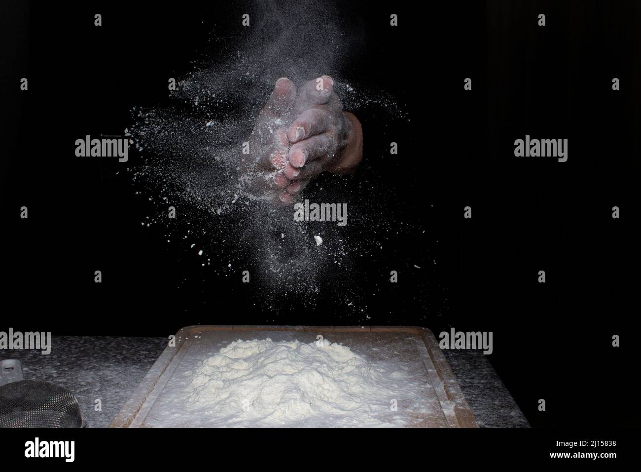 woman hands with flour, clapping Stock Photo - Alamy