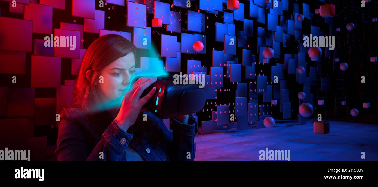 Hispanic woman looking inside virtual reality goggles with digital ...