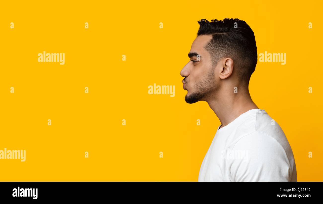 Profile photo of millennial muslim man on yellow, panorama Stock Photo ...