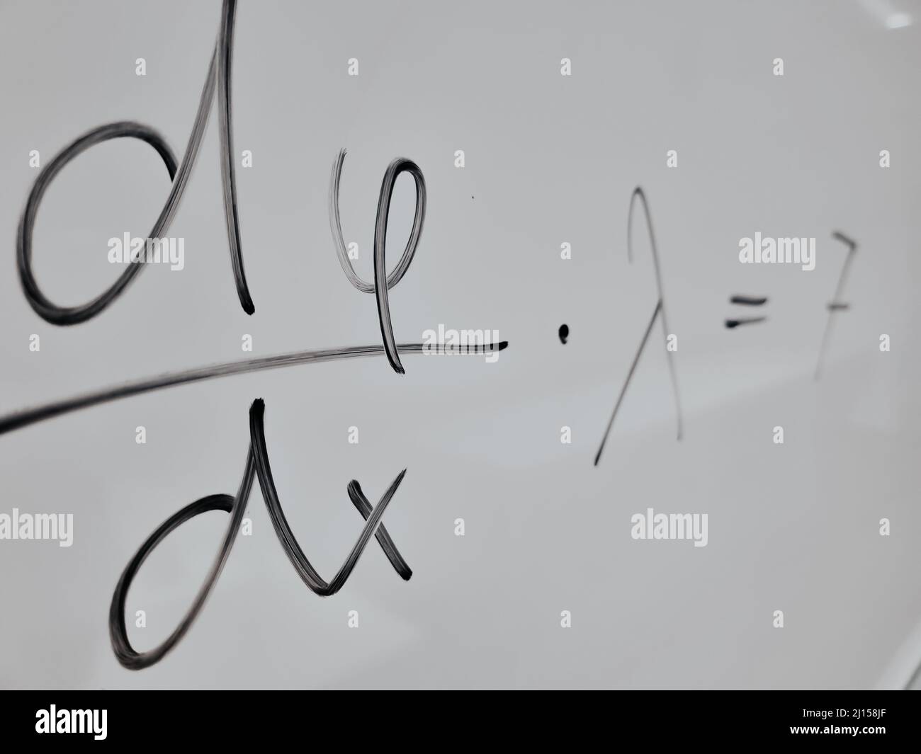 mathematical symbols of an equation from a mathematics lecture on a ...