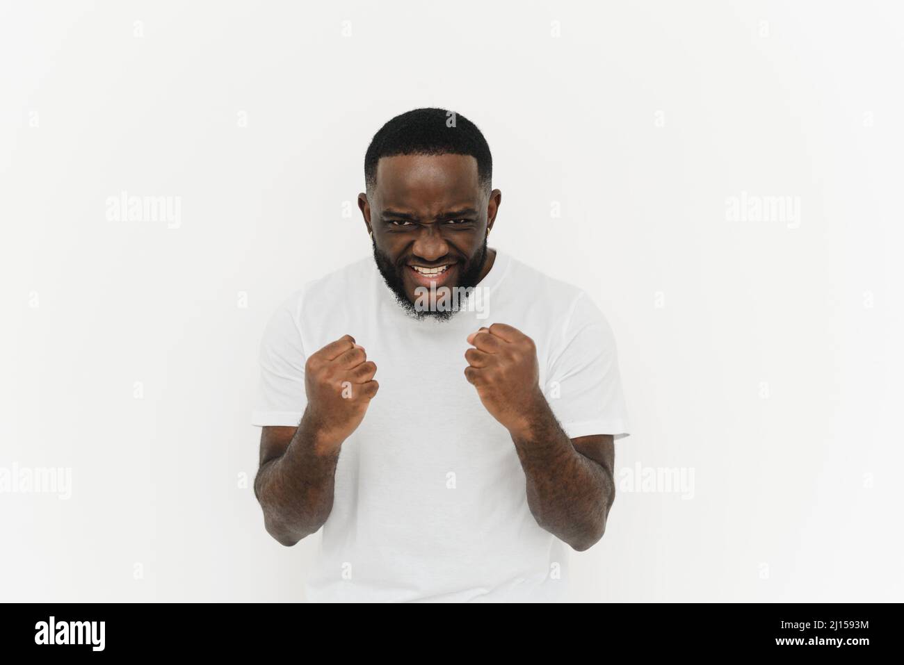 Great luck. Excited crazy african american guy screaming with joy while ...